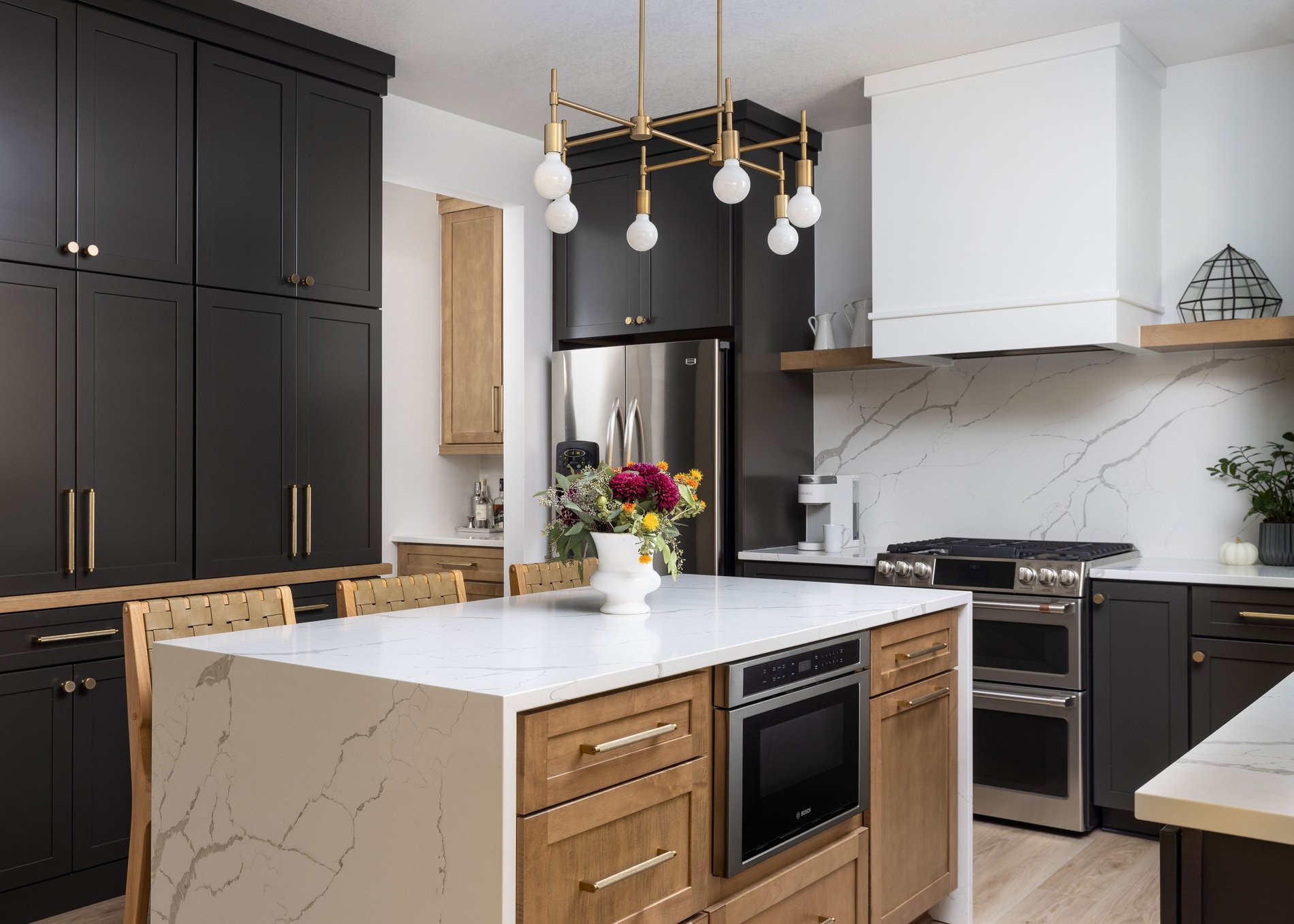 Charcoal, White, and Wood Tones Achieve Balance in a Timeless Kitchen