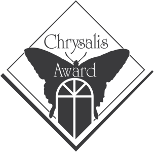 Charcoal, White, and Wood Tones Achieve Balance in a Timeless Kitchen